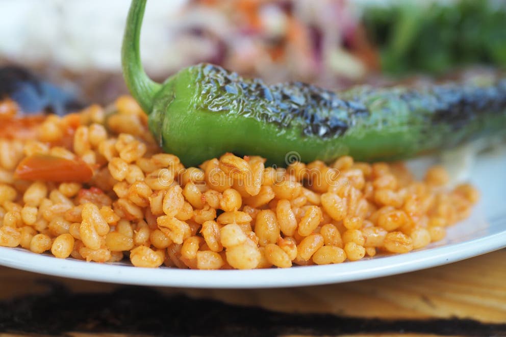 Bulgur Rice with Tomato on a Plate , Stock Photo - Image of seed ...