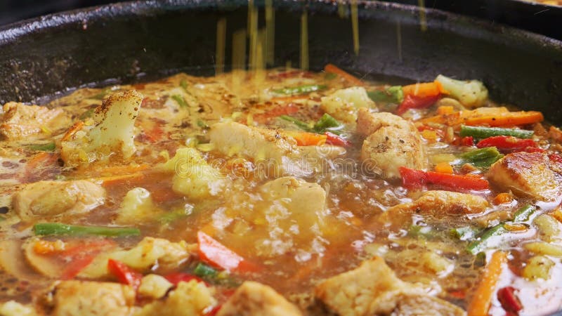 Bulgur and Vegetables with Chicken in Spices in a Frying Pan Stock ...