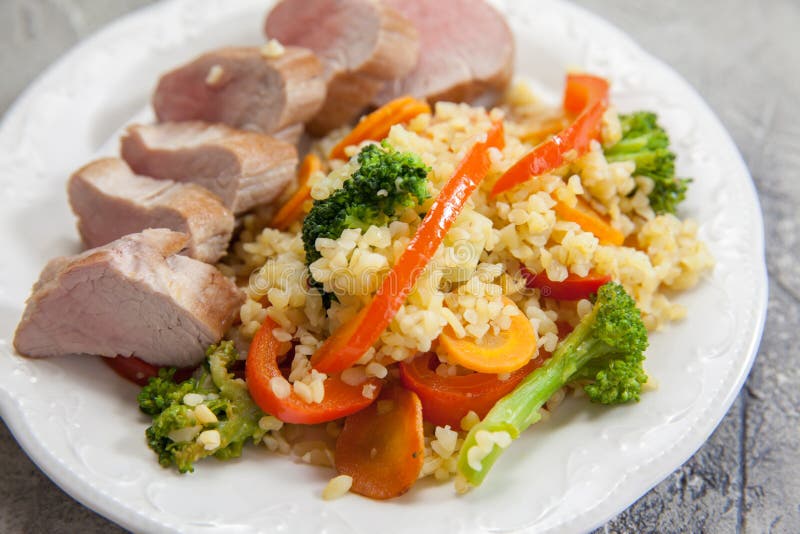 Bulgur with Vegetables and Roast Beef Veal Stock Photo - Image of plate ...