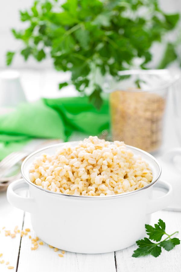 Bulgur Wheat. Boiled Bulgur Cereal in Pot on White Kitchen Table Stock ...