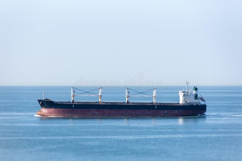 Cargo Ship, Bulk Carrier Sailing through the Calm, Blue Sea. Stock ...