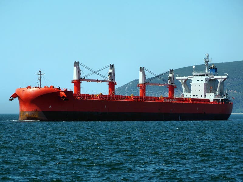 Red Cargo Ship Underway To Port Stock Photo - Image of container ...