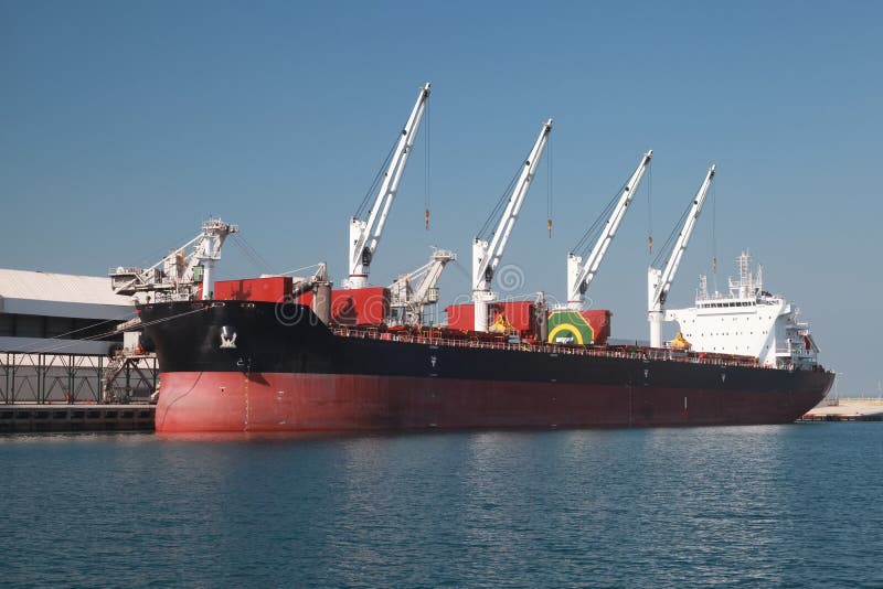 Bulk Carrier Ship is Loading in a Port on a Sunny Day Stock Photo ...