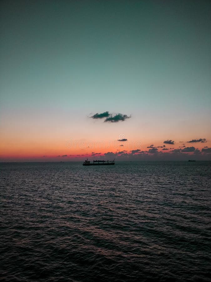 A Bulk Carrier Ship Passing during Sunset Time Stock Image - Image of ...