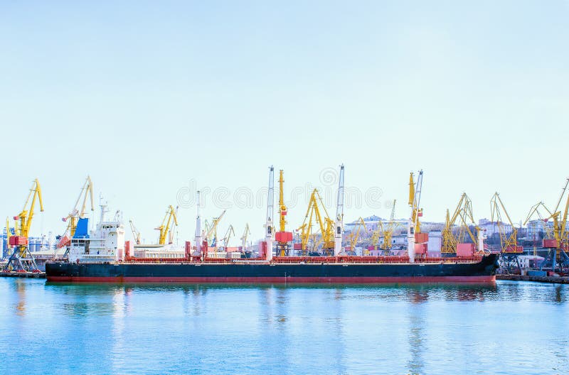 Bulk Carrier Ship in the Port on Loading. Bulk Cargo Ship Under Port ...