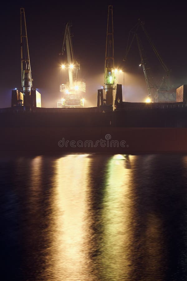 Bulk Carrier Unloading at a Foggy Night Stock Image - Image of cargo ...