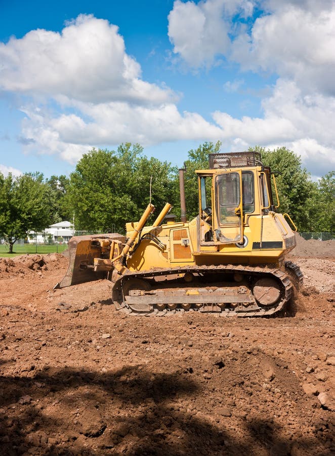 Yellow bulldozer stock photo. Image of mound, soil, green - 34982894