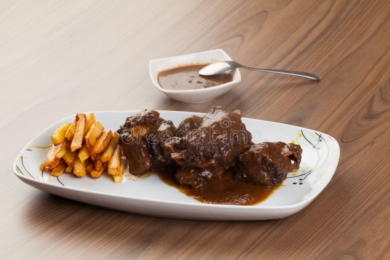 Fried Bull Testicles with Potatoes and Mushroom Sauce Stock Image ...