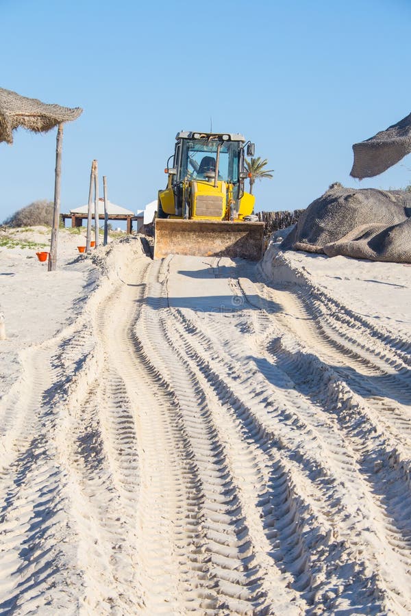 Bulldozer at beach stock photo. Image of heavy, vehicle - 26607050