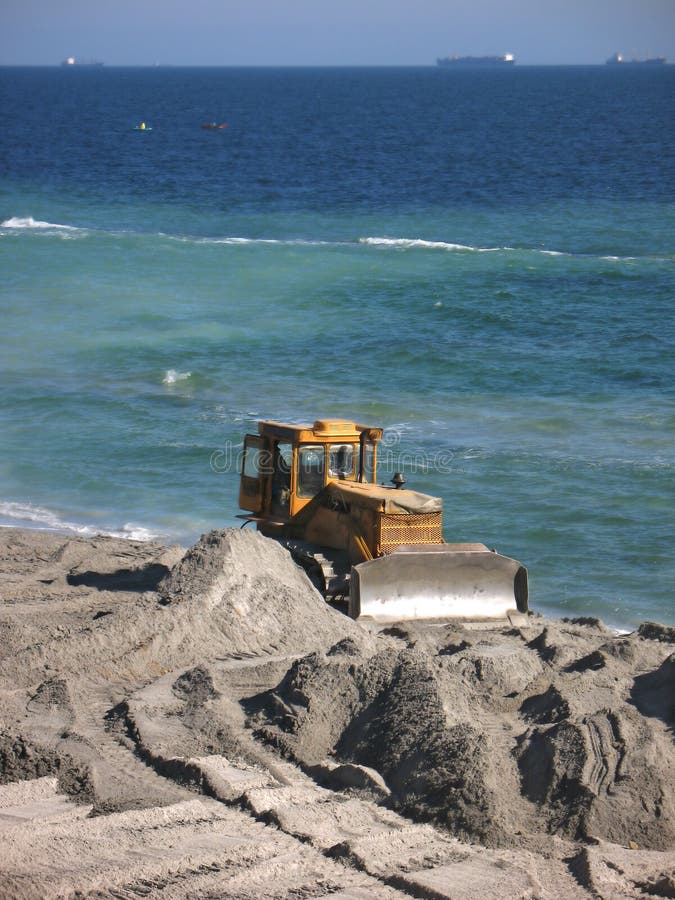 Bulldozer on the beach stock image. Image of caterpillar - 4081313