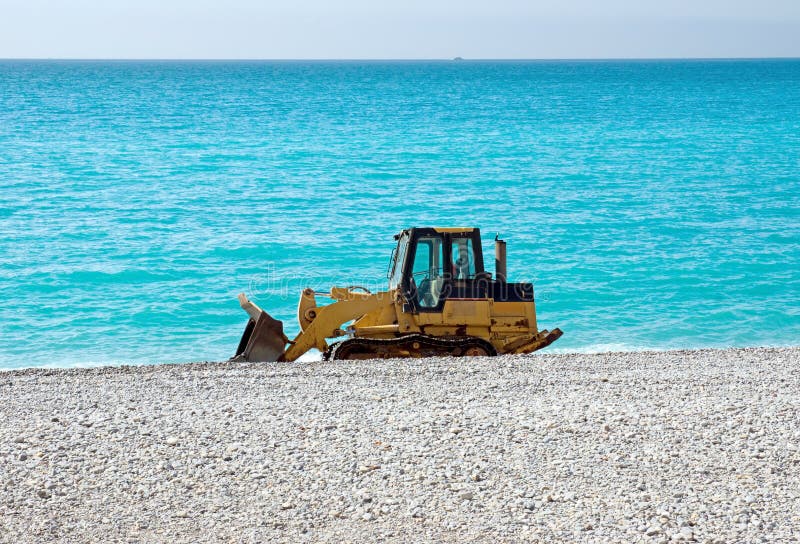 Bulldozer on the beach stock image. Image of france, equipment - 31682629
