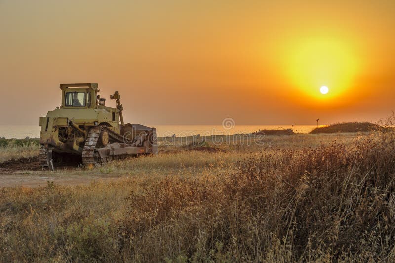 Bulldozer on the beach stock image. Image of machinery - 109497763