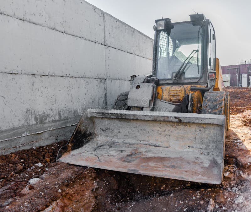 Bulldozer and Brick and Concrete House Under Construction Stock Image ...
