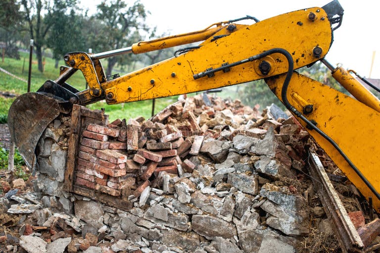 Bulldozer on Demolition Site Working on an Old Building and Load Stock ...