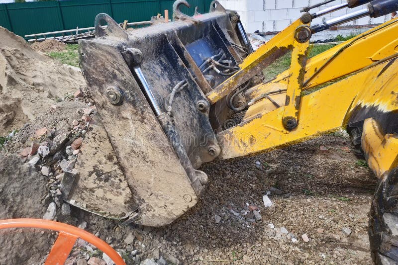 A Bulldozer Disposes of Debris on the Construction Site of a Private ...