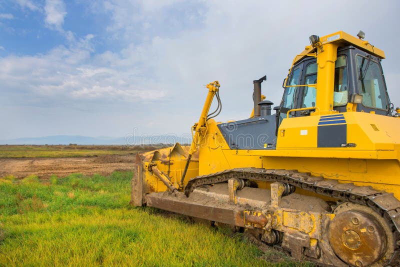 Bulldozer in the field stock photo. Image of earthmover - 78200618