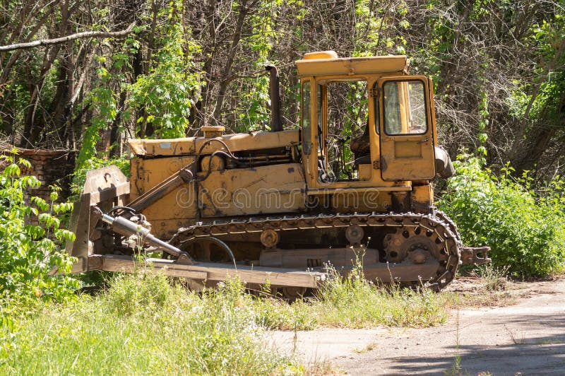 Bulldozer in the Forest. Large Tractor with a Bucket Stock Photo ...