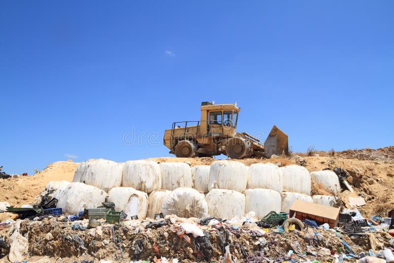Bulldozer in landfill stock image. Image of environment - 26596855