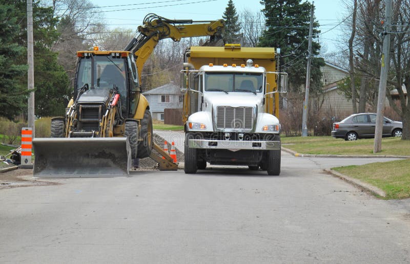Bulldozer Loading Earth on Truck Stock Image - Image of bucket, ladle ...