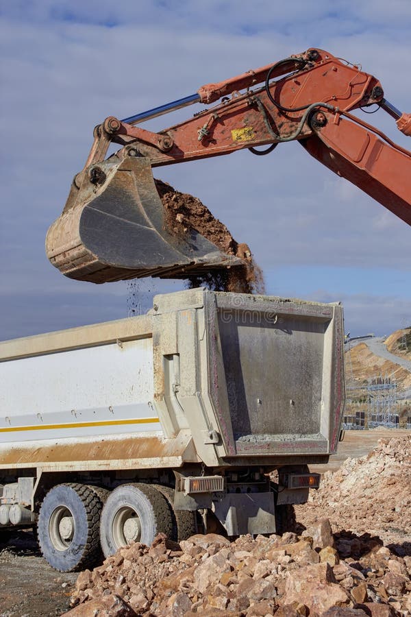 Bulldozer Loading Sand into the Truck Stock Image - Image of soil ...