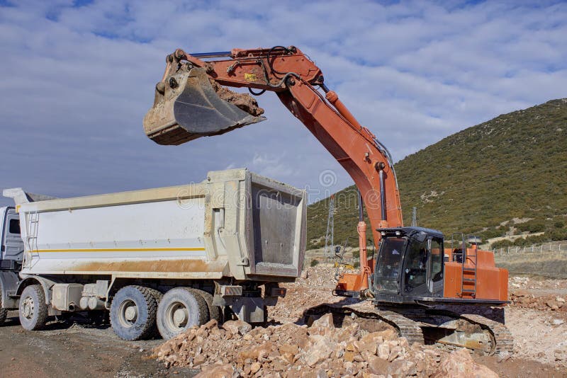 Bulldozer Loading Sand into the Truck Stock Photo - Image of mover ...
