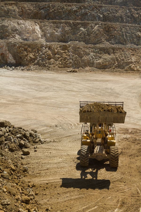 Bulldozer loading truck stock photo. Image of large, brown - 78340080