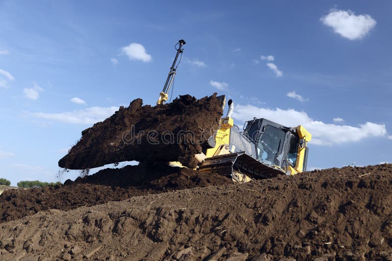 Bulldozer moving dirt stock image. Image of mechanical - 16007325