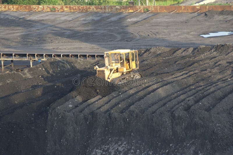 Bulldozer at a coal mine. stock image. Image of industry - 12096871