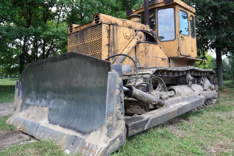 Bulldozer in park stock image. Image of green, ground - 11471037