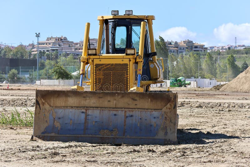 Bulldozer Parked at a Construction Site Stock Image - Image of outdoors ...