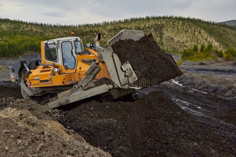Bulldozer is Pushing the Gold Sands. Gold Mining in Kolyma Stock Image ...