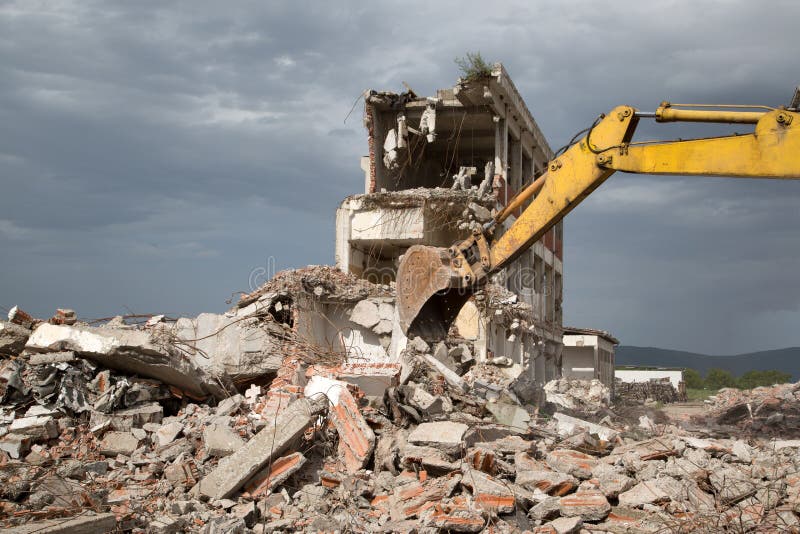 Bulldozer Removes the Debris from Demolition of Derelict Buildings ...