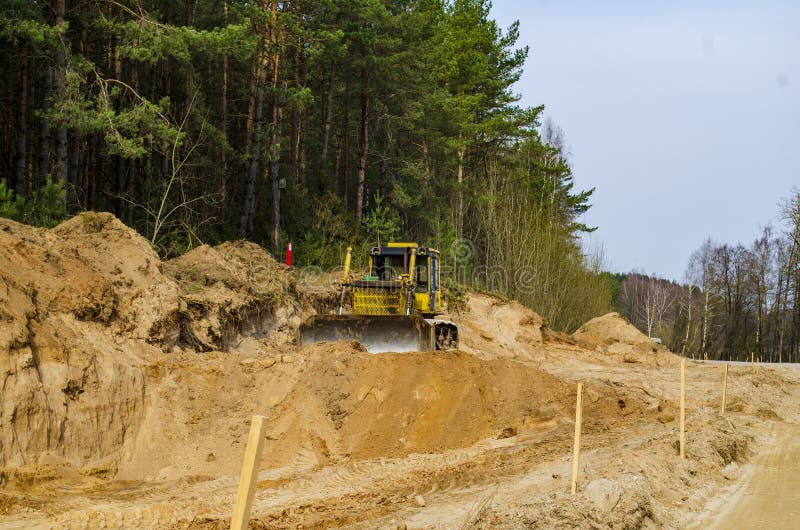 Bulldozer on the road stock photo. Image of road, asphalting - 179207660
