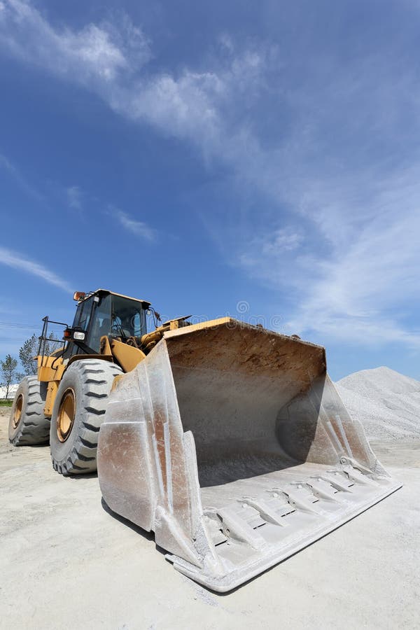 Bulldozer with sand mound stock photo. Image of dozer - 60034212