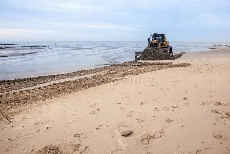 Bulldozer at sea stock photo. Image of industry, construction - 64057142