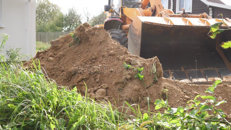 Bulldozer Works on a Construction Site with Sand To Level the Ground ...