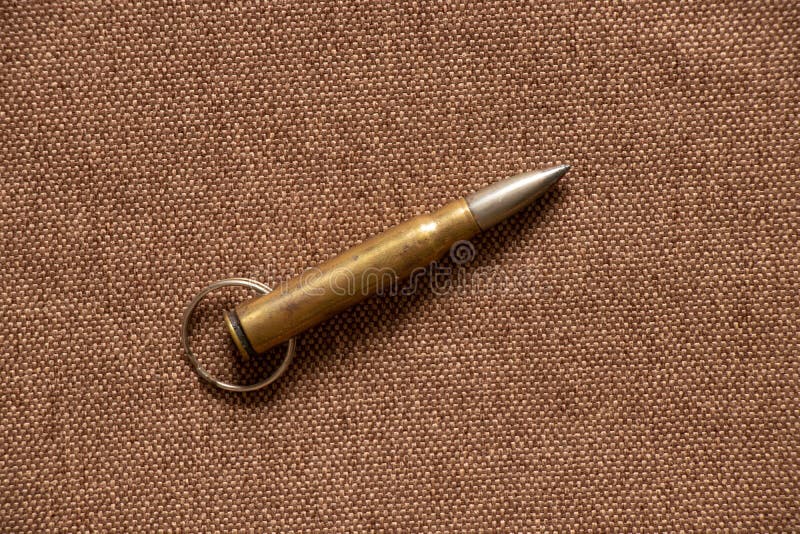 Bullet on Brown Fabric As a Keychain Close Up Stock Photo - Image of ...