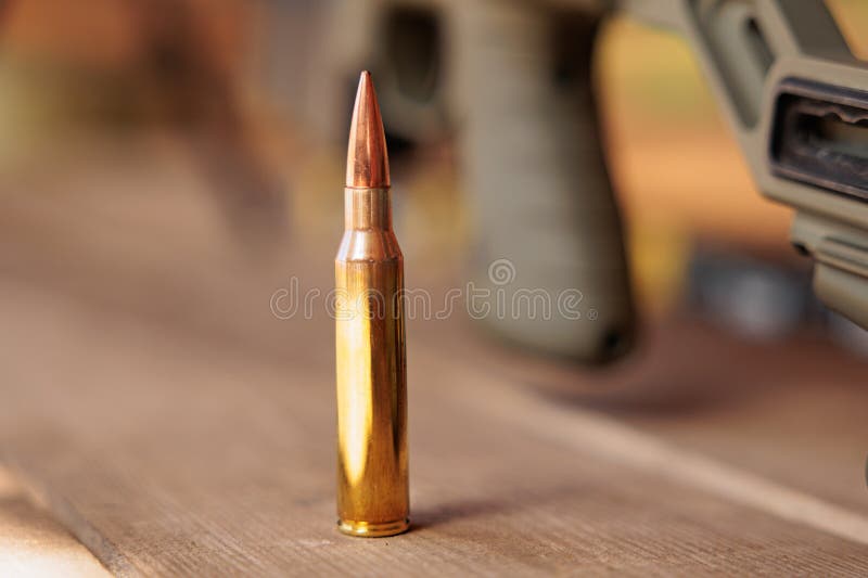 A Bullet with a Gold Tip. the Bullet is Shiny Stock Image - Image of ...