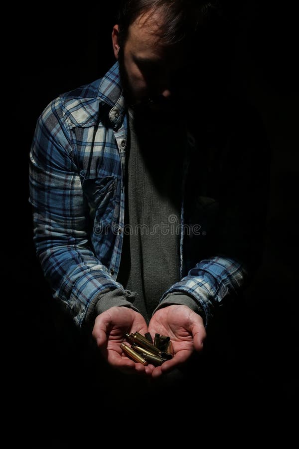 Black Background with Bullet in Hands Man Stock Image - Image of ...