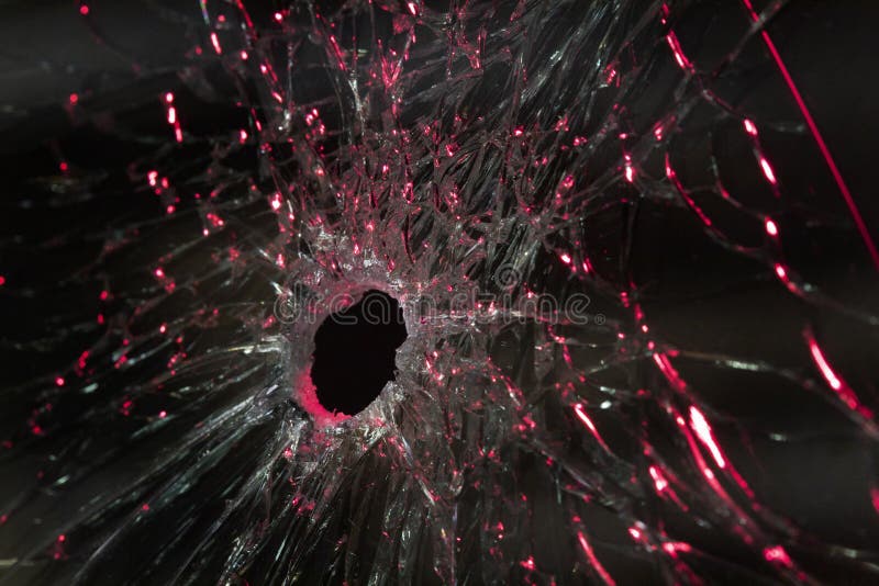 Bullet Hole through Red Windshield Stock Photo - Image of window ...