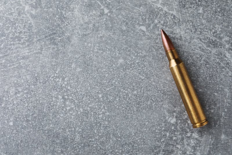 Bullet on Light Grey Table, Top View. Space for Text Stock Image ...
