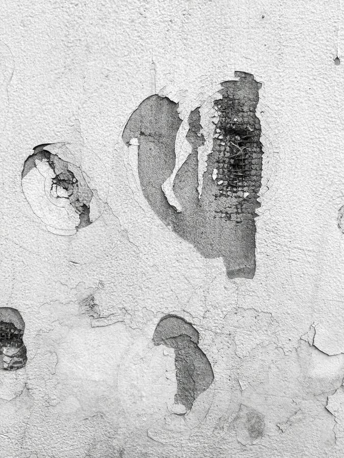 Bullet marks on the wall stock photo. Image of fence - 235672020