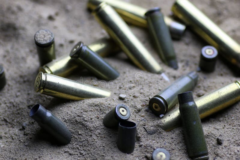 Bullet in the sand stock image. Image of armament, machine - 90655155