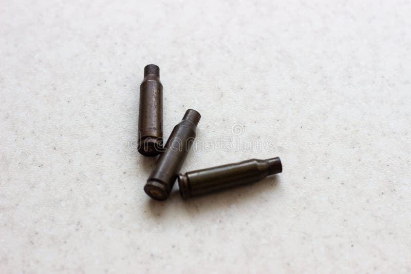 Bullet Shells on a White Surface. Shell Casings on a White Background ...