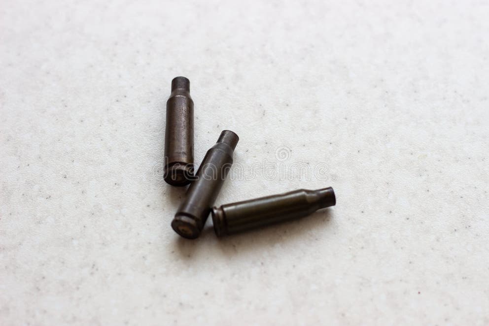 Bullet Shells on a White Surface. Shell Casings on a White Background ...