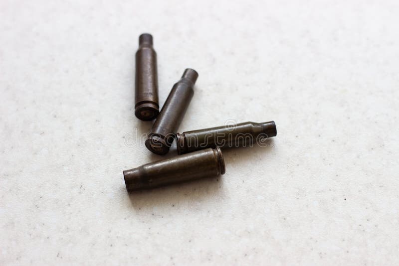 Bullet Shells on a White Surface. Shell Casings on a White Background ...