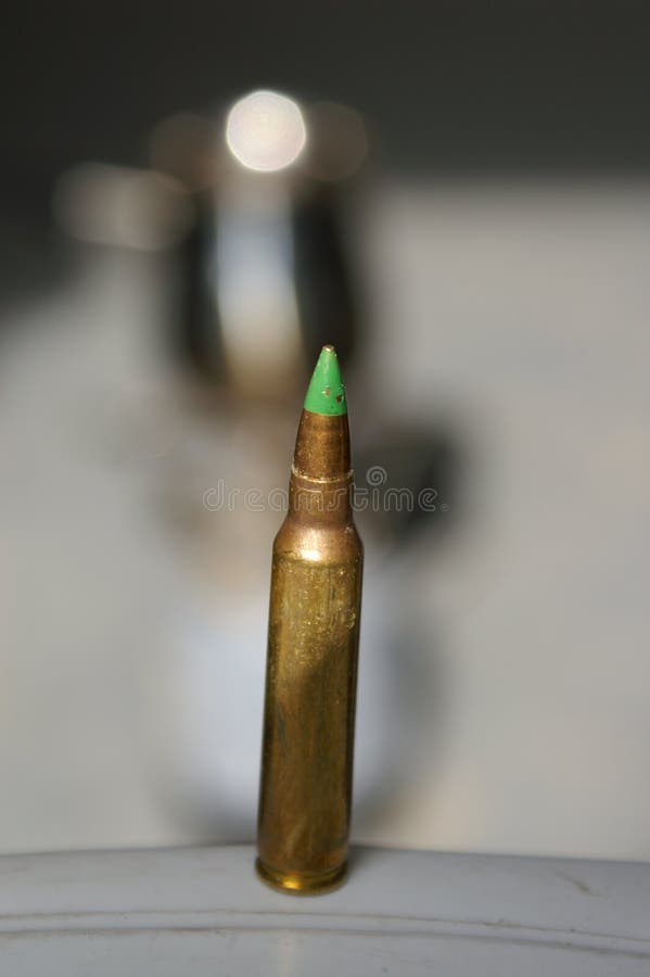 A bullet on a table, M-16 bullet - army