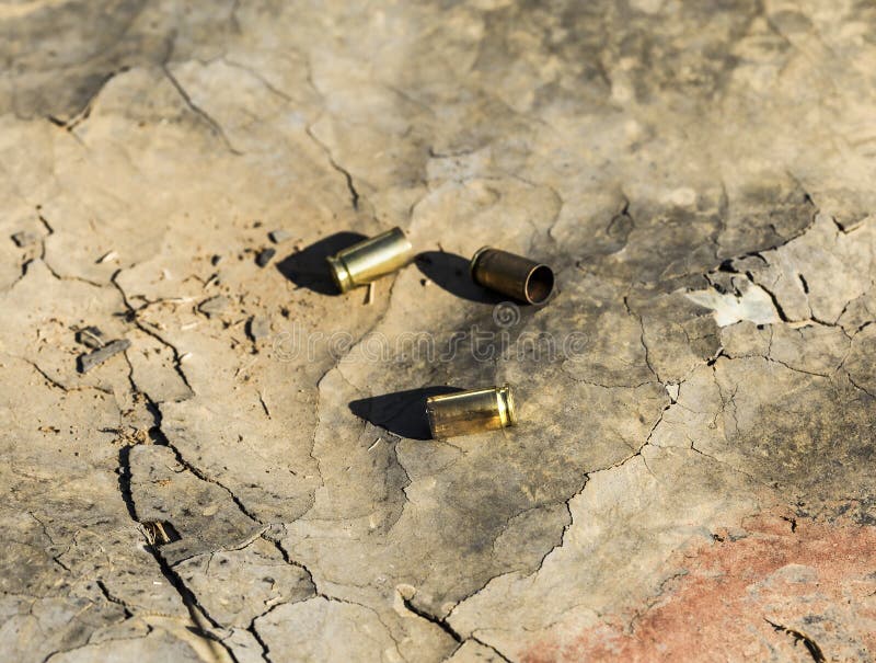 Bullets on the ground stock photo. Image of handgun, lighting - 30433090