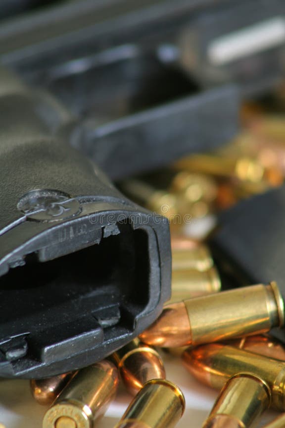 Bullets & gun vertical stock image. Image of firearm - 1570889