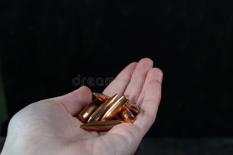 A Hand Full of Bullets - Ammunition Stock Photo - Image of hollowpoint ...